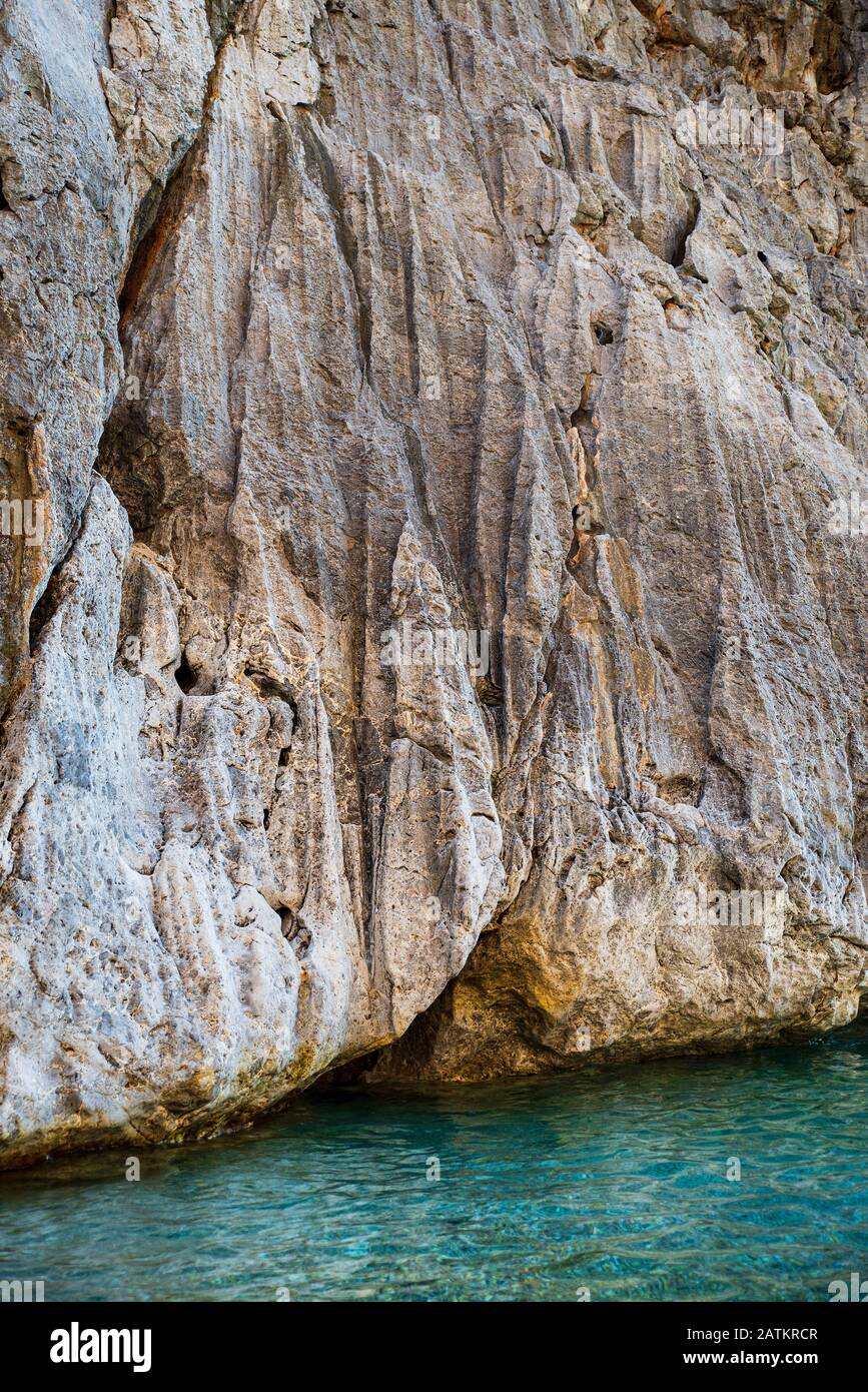 Giant rock washed by transparent turquoise seawater. Majesty and beauty ...