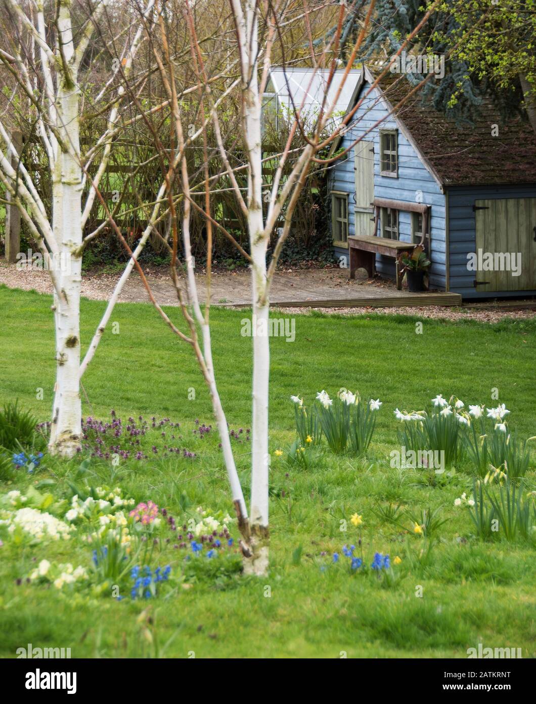 Early spring garden with Wendy House Stock Photo - Alamy