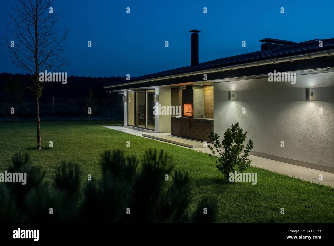 Modern spa building with luminous lamps on the dark sky background. It ...