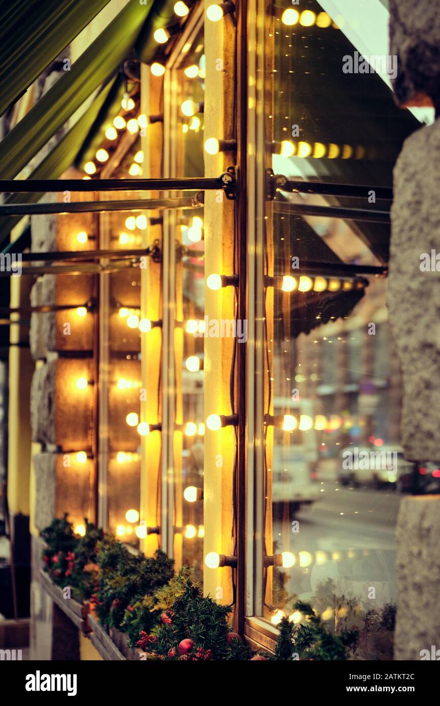 The facade of the restaurant building is decorated with lights ...