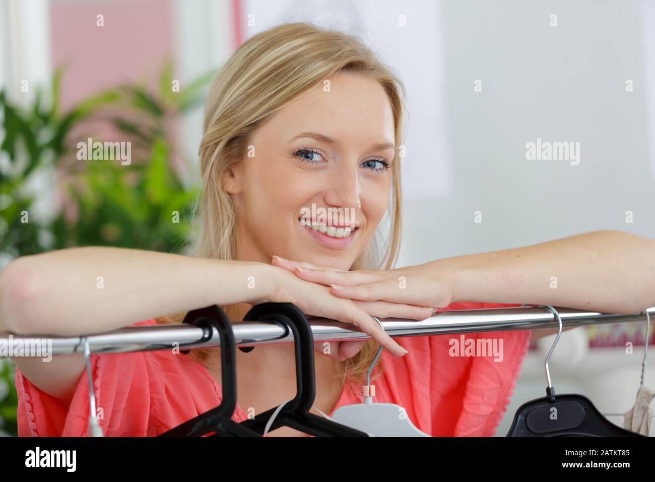 positive smiling female seller looking at camera Stock Photo - Alamy