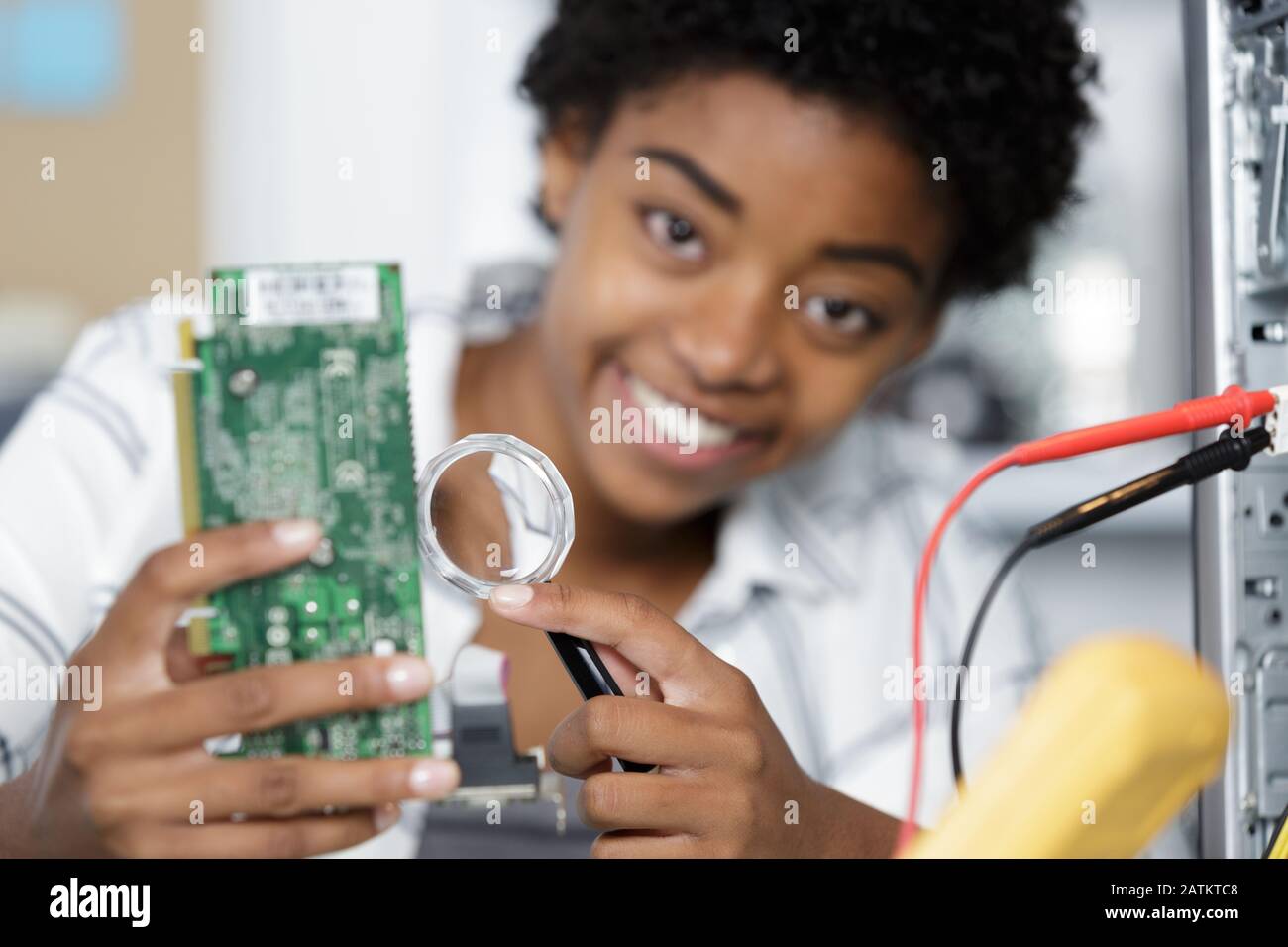 female engineer testing circuit board Stock Photo - Alamy