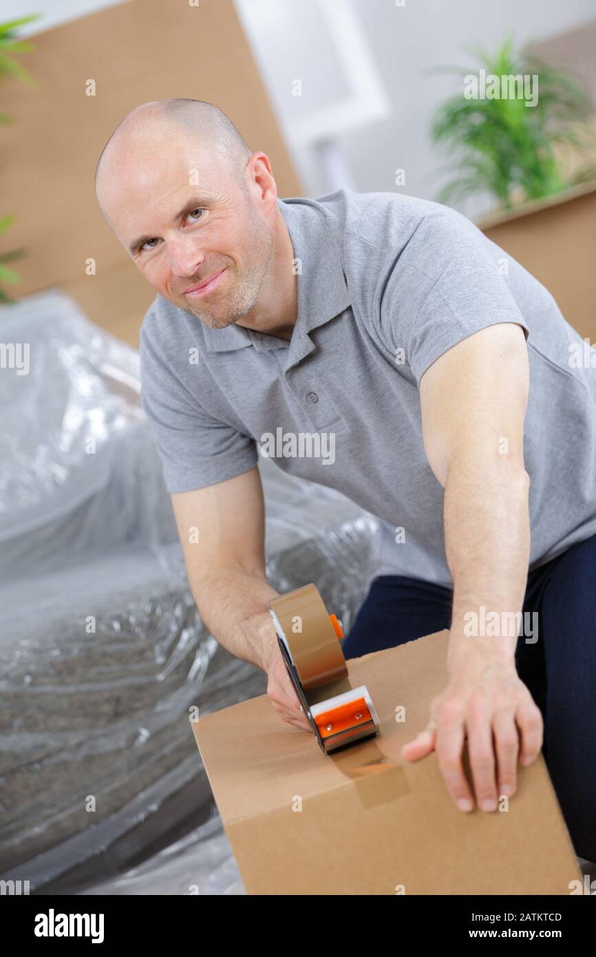 worker preparing goods for shipping Stock Photo - Alamy