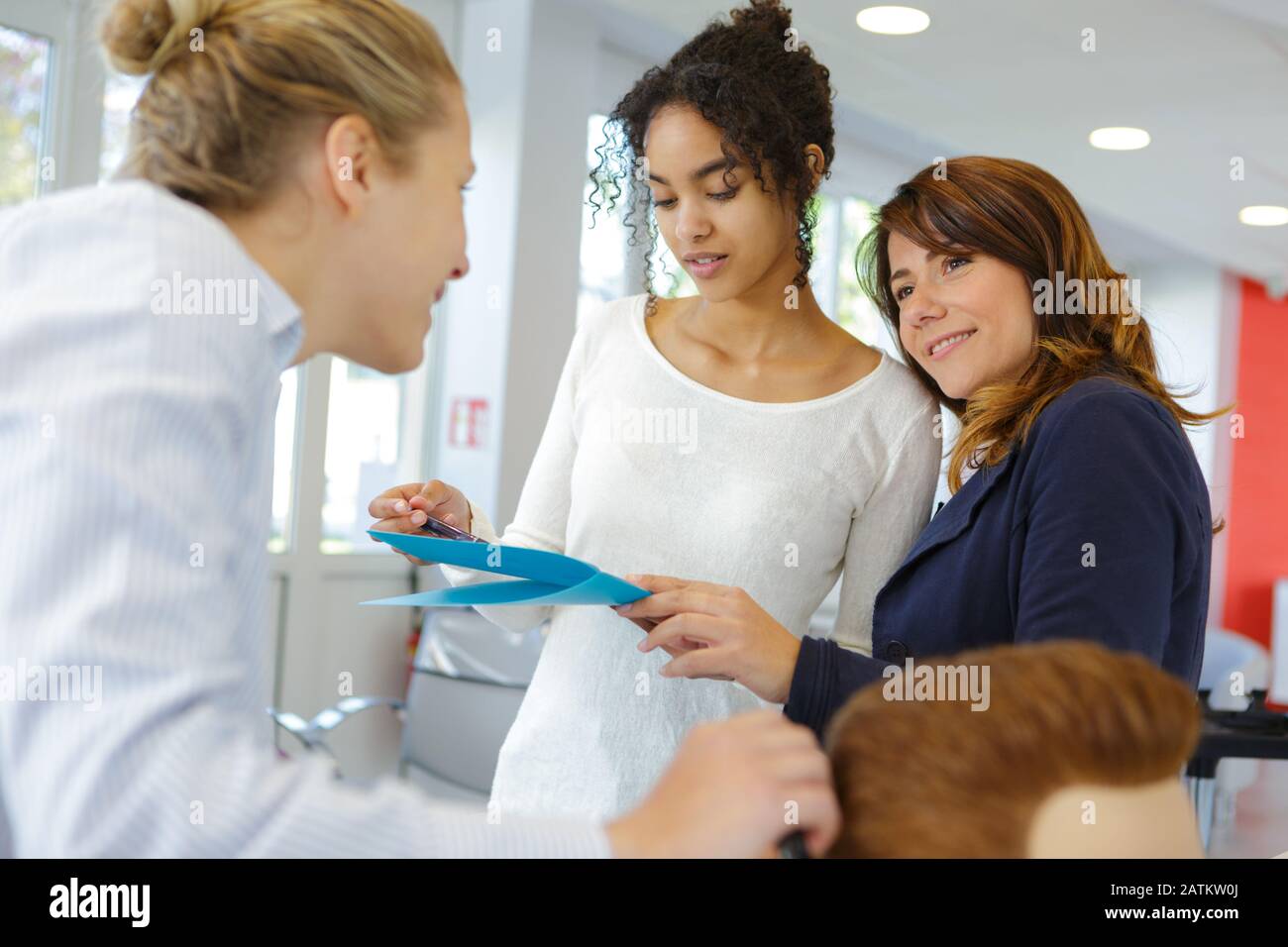 three women in hairdressing salon Stock Photo - Alamy