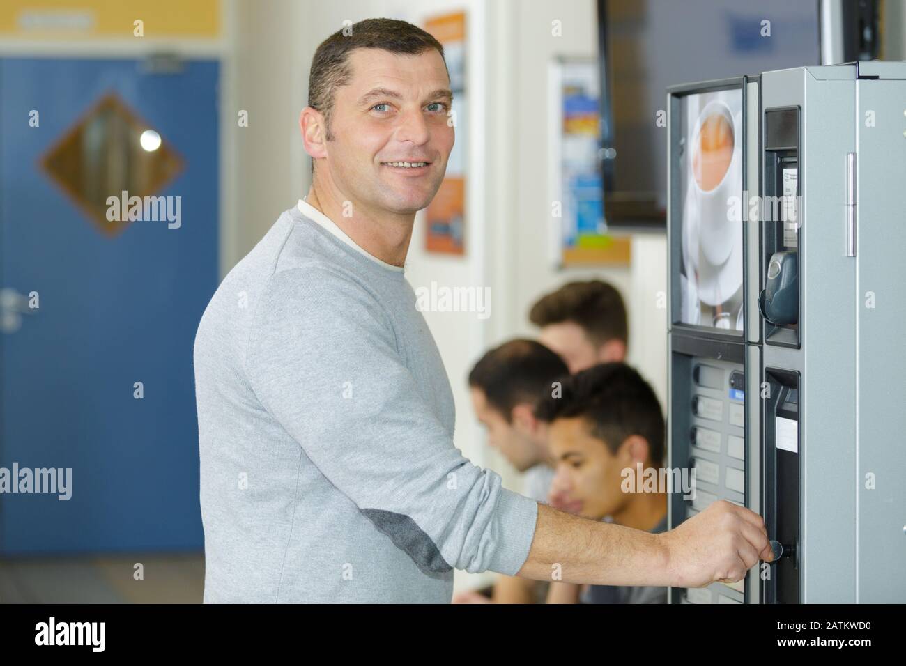 portrait of a man getting a coffee Stock Photo - Alamy