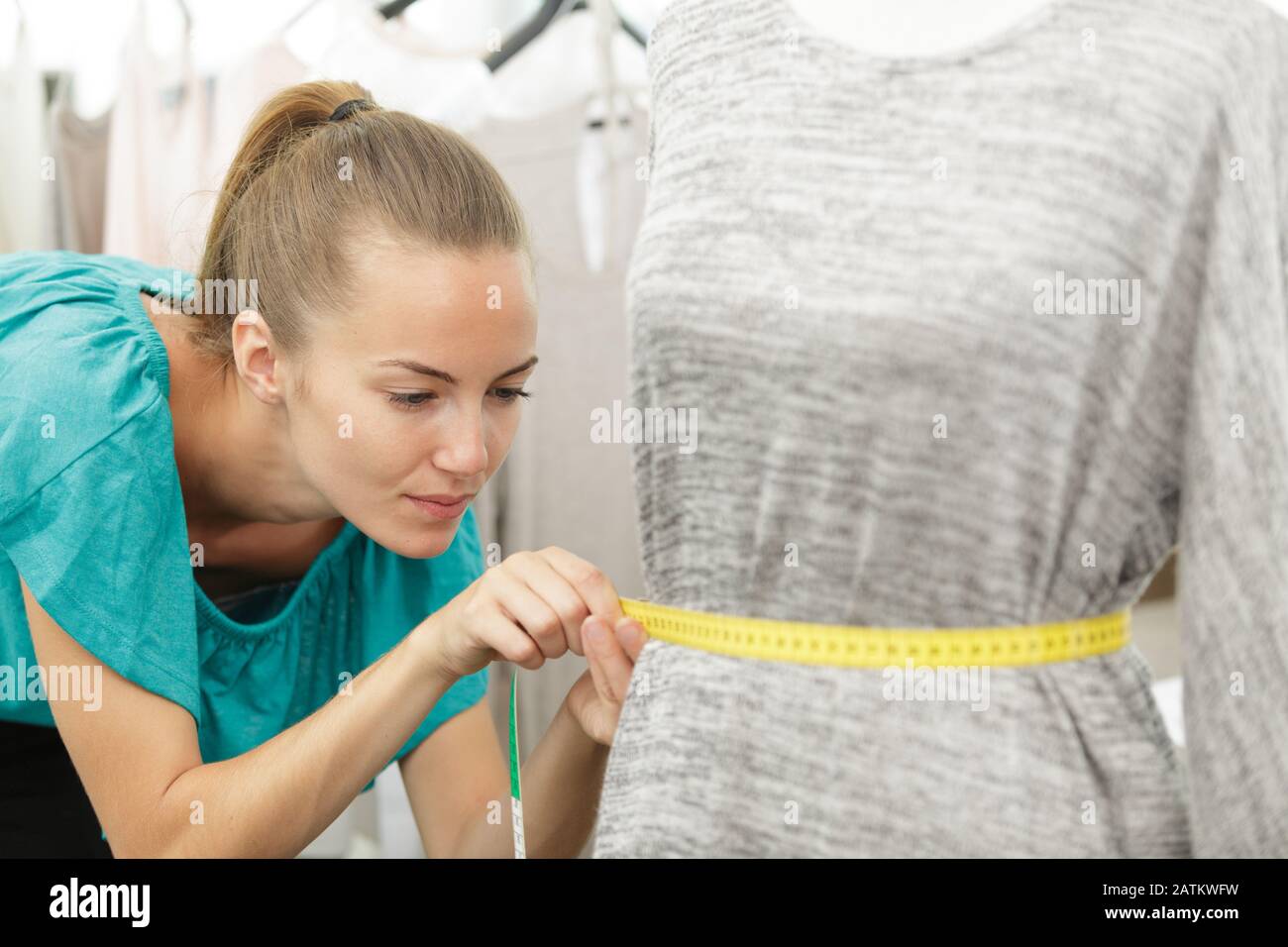 happy nice woman making a waist measurement Stock Photo - Alamy