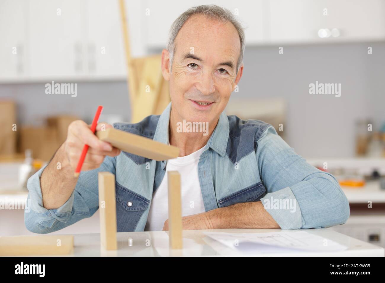 a senior man doing diy Stock Photo - Alamy