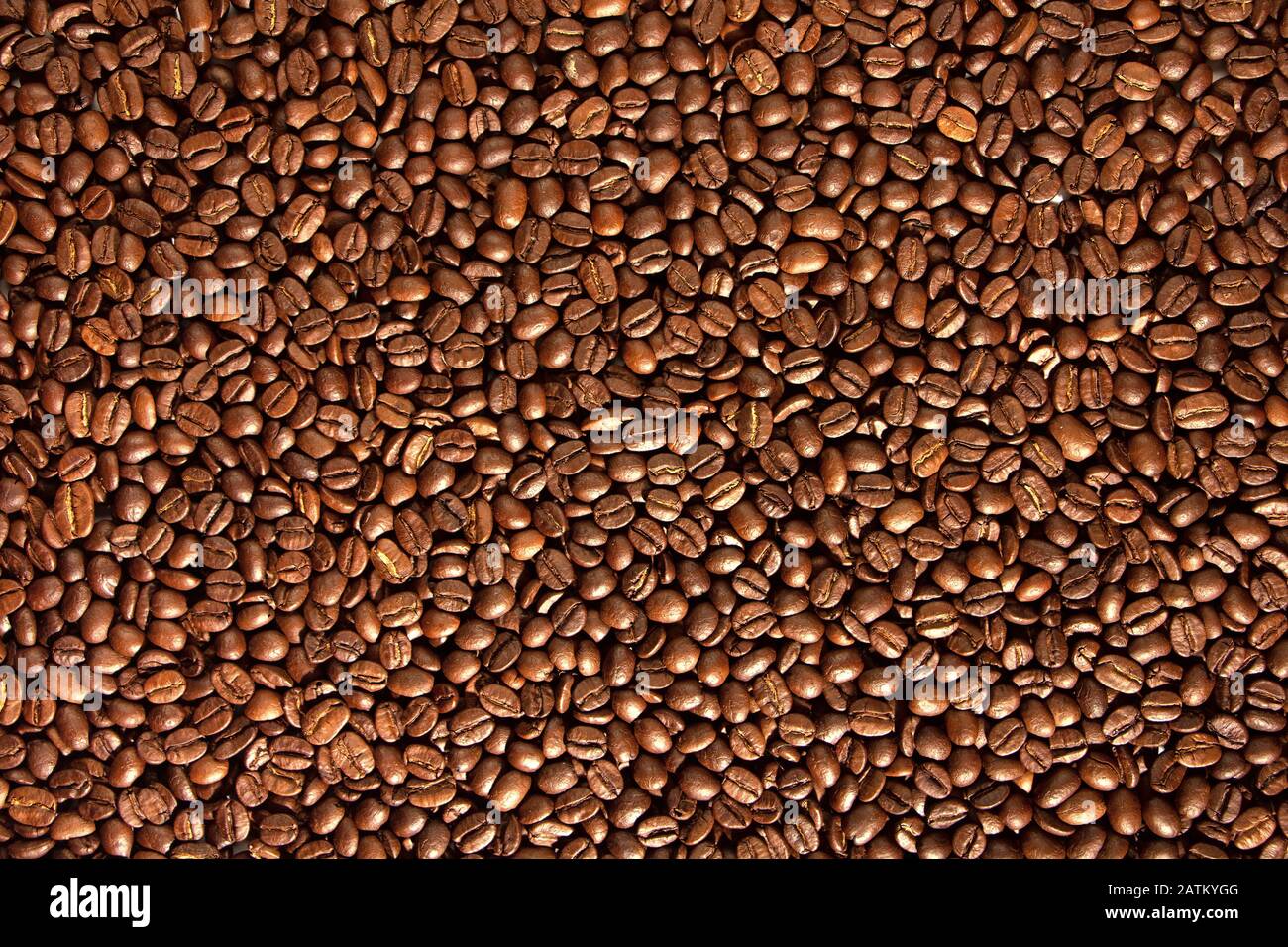 Coffee seeds, texture, natural organic dark background Stock Photo - Alamy