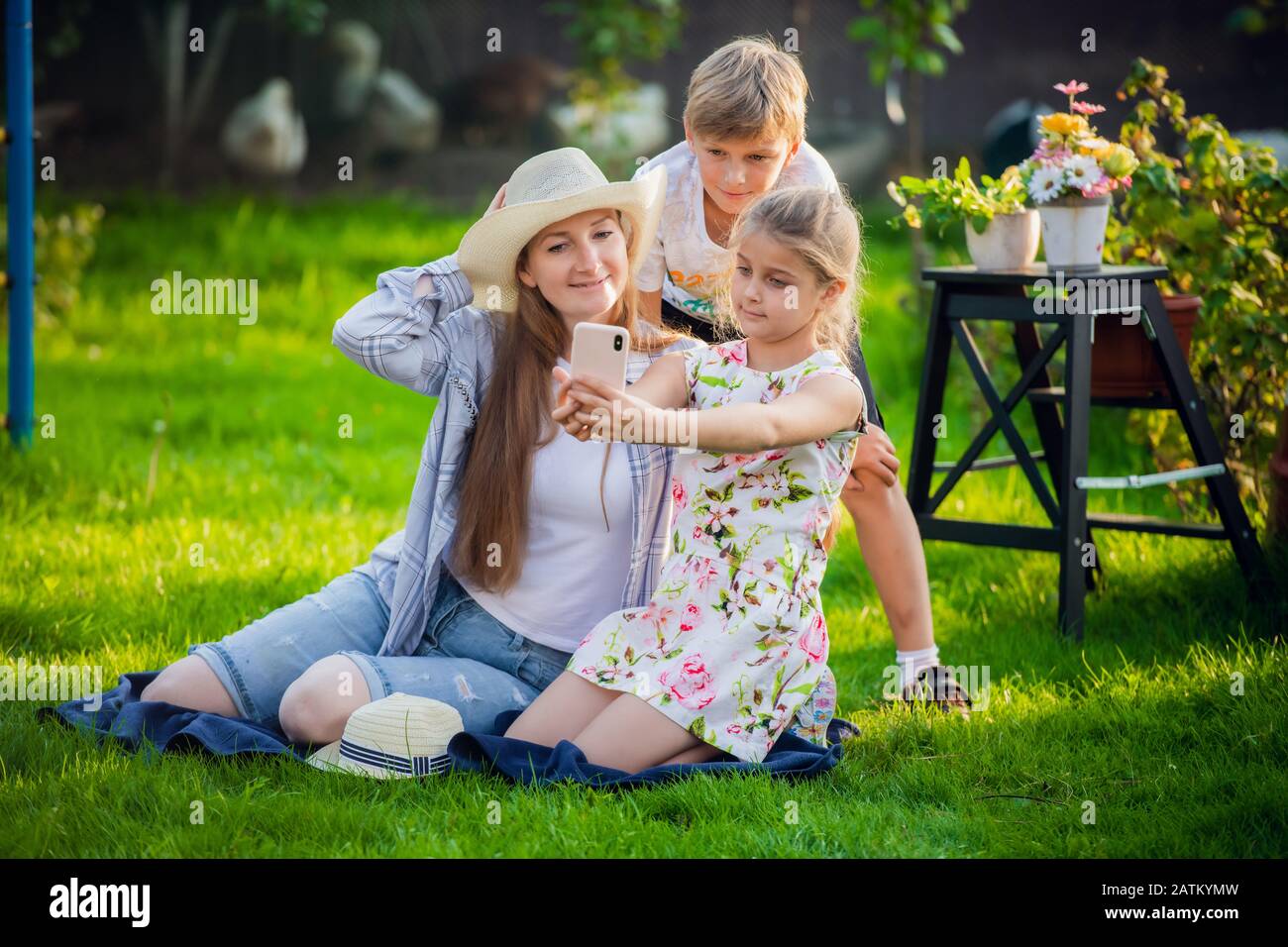 Young mother with pretty daughter and handsome son make photo in ...