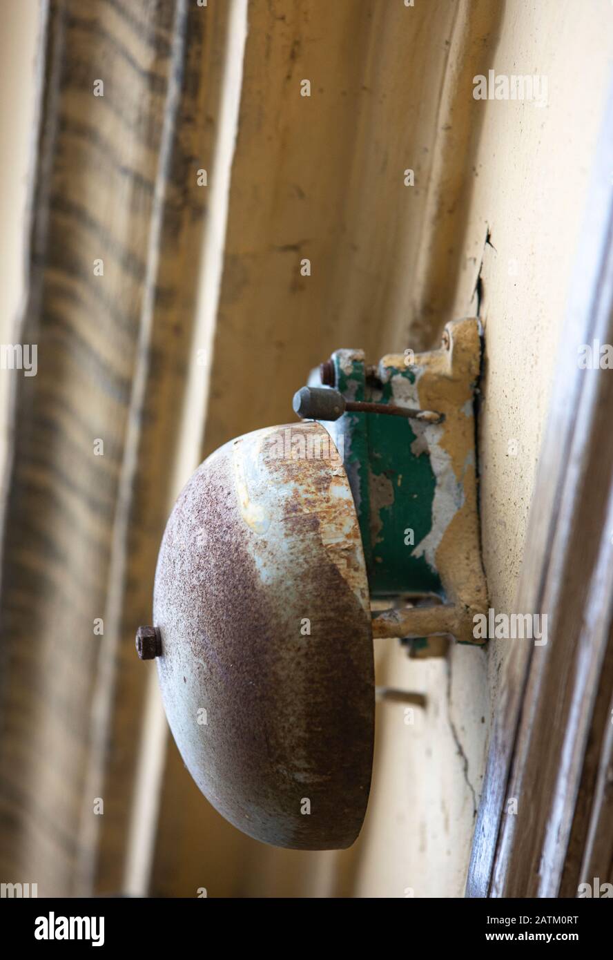 School bell, old electrical rusty device. Elementary school in Poland ...