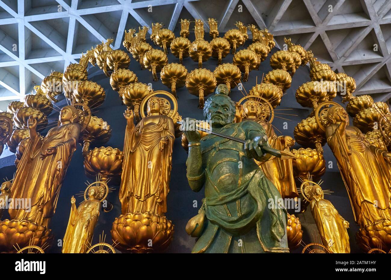 OSAKA, JAPAN - OCTOBER 16, 2019: The golden statues of Buddhas with ...