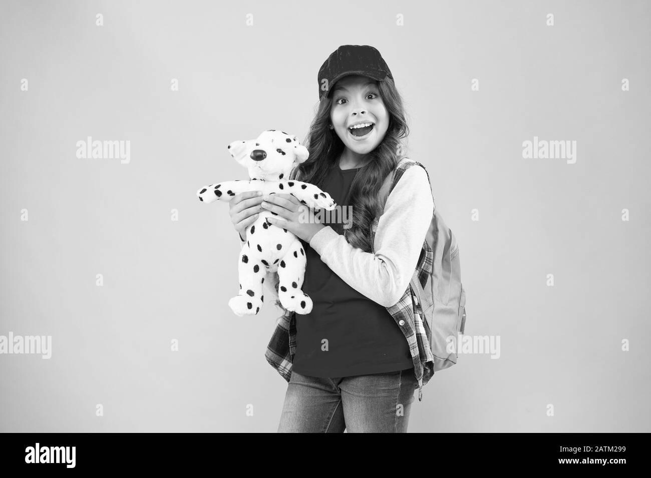Toy shop is great for tiny urbanites. Happy little girl shopping in toy ...