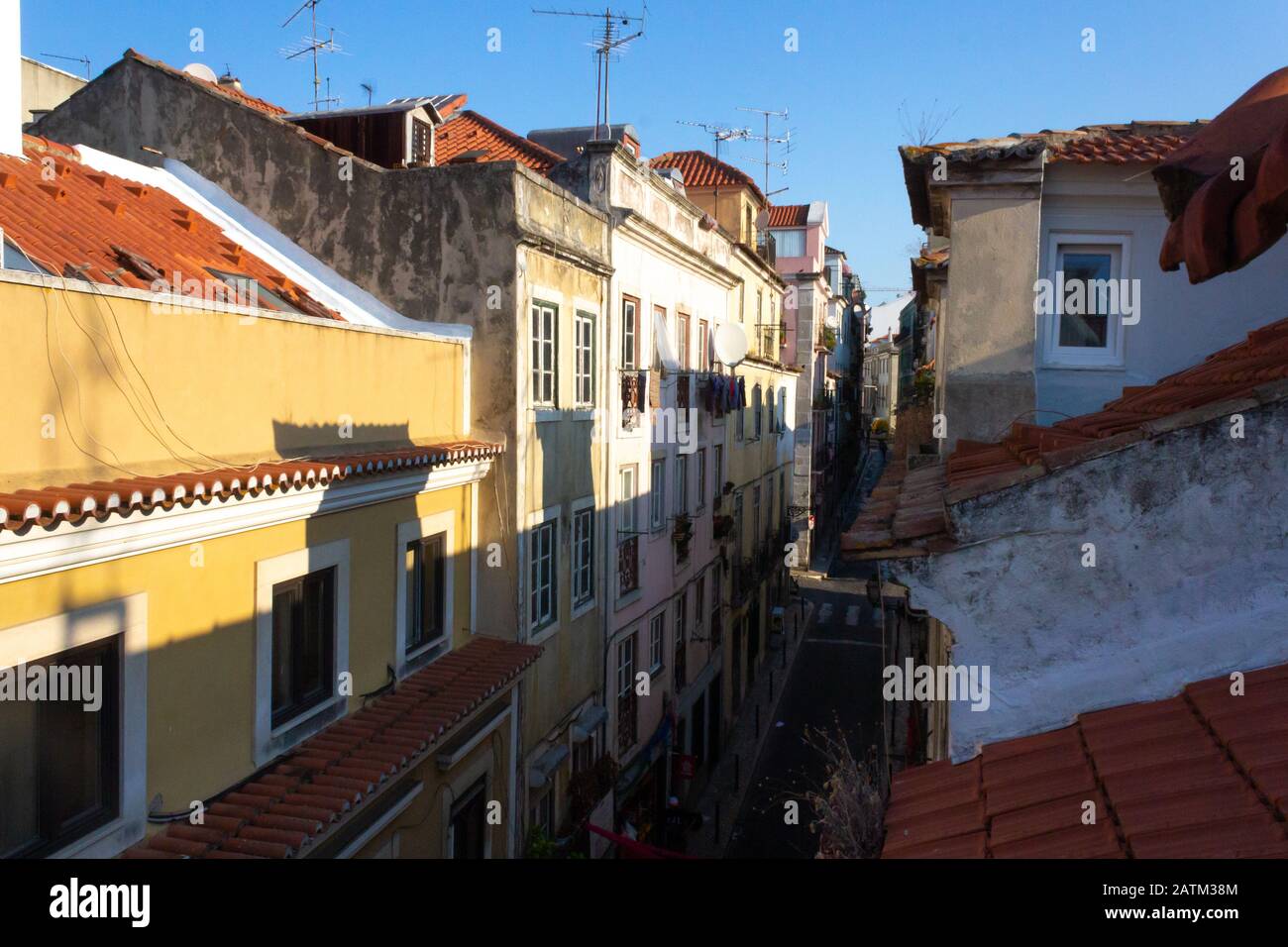 Perspective view of narrow European city street Stock Photo - Alamy