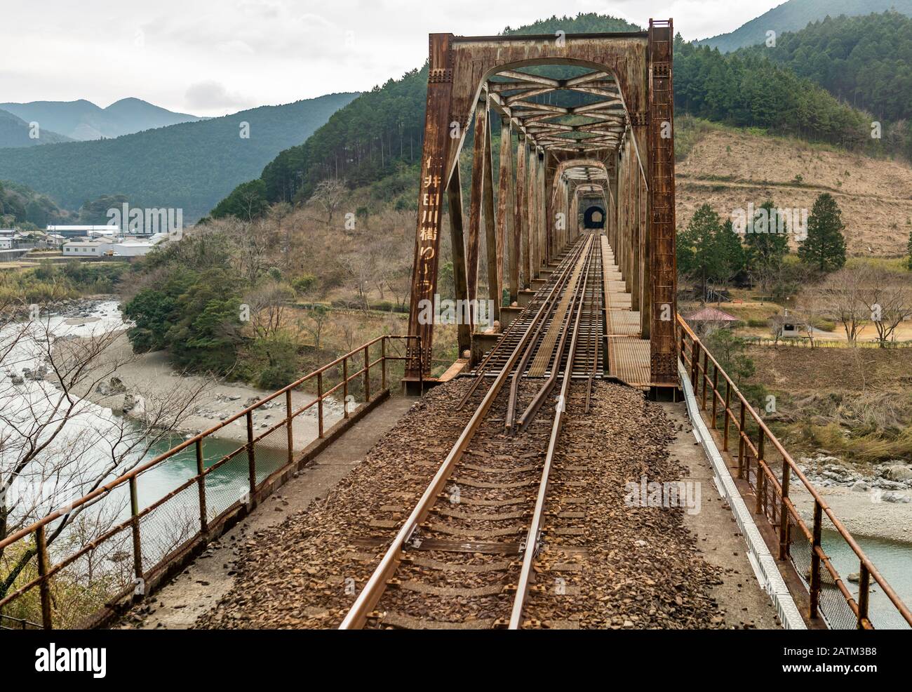 A view of a bridge over the Shimanto River seen from a Shikoku Railway ...