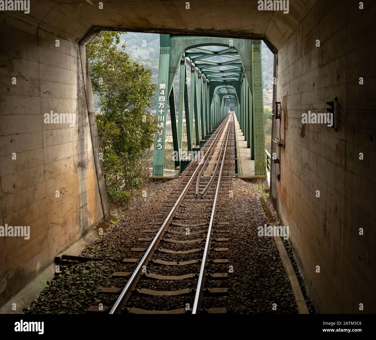 A view of a bridge over the Shimanto River seen from a Shikoku Railway ...