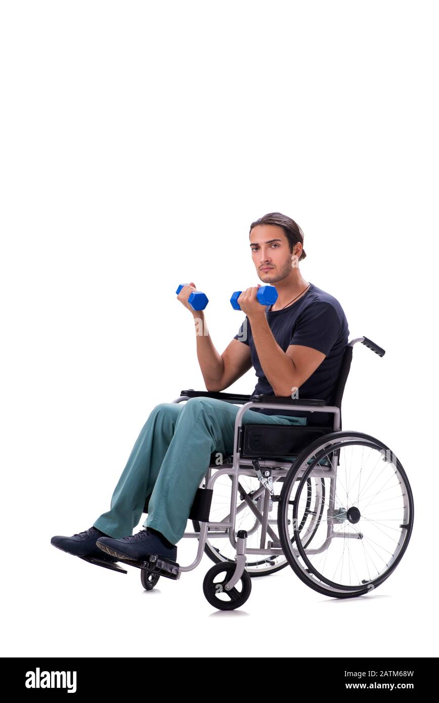 The young disabled man doing physical exercises isolated on white Stock ...