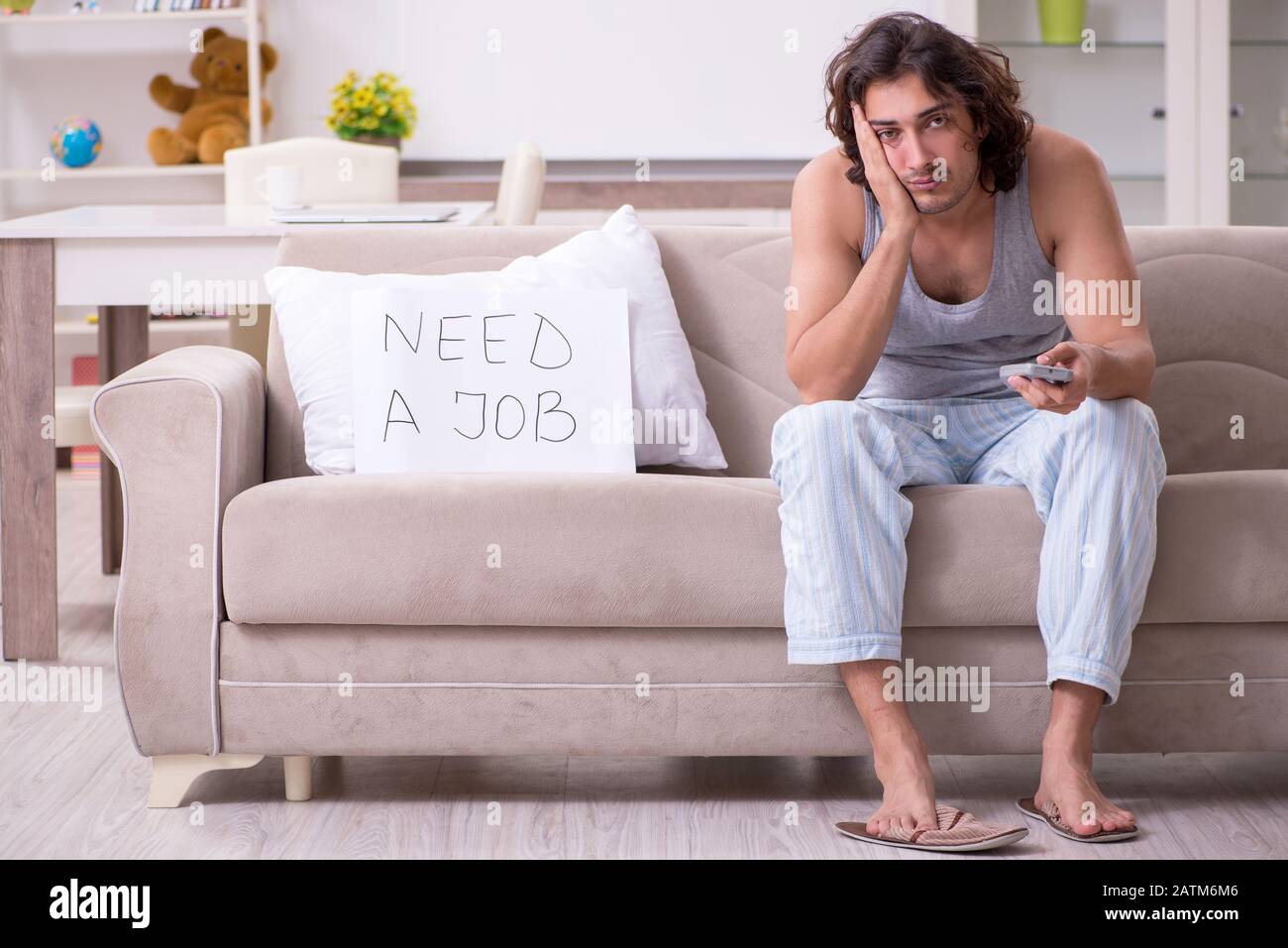 The unemployed man desperate at home Stock Photo - Alamy