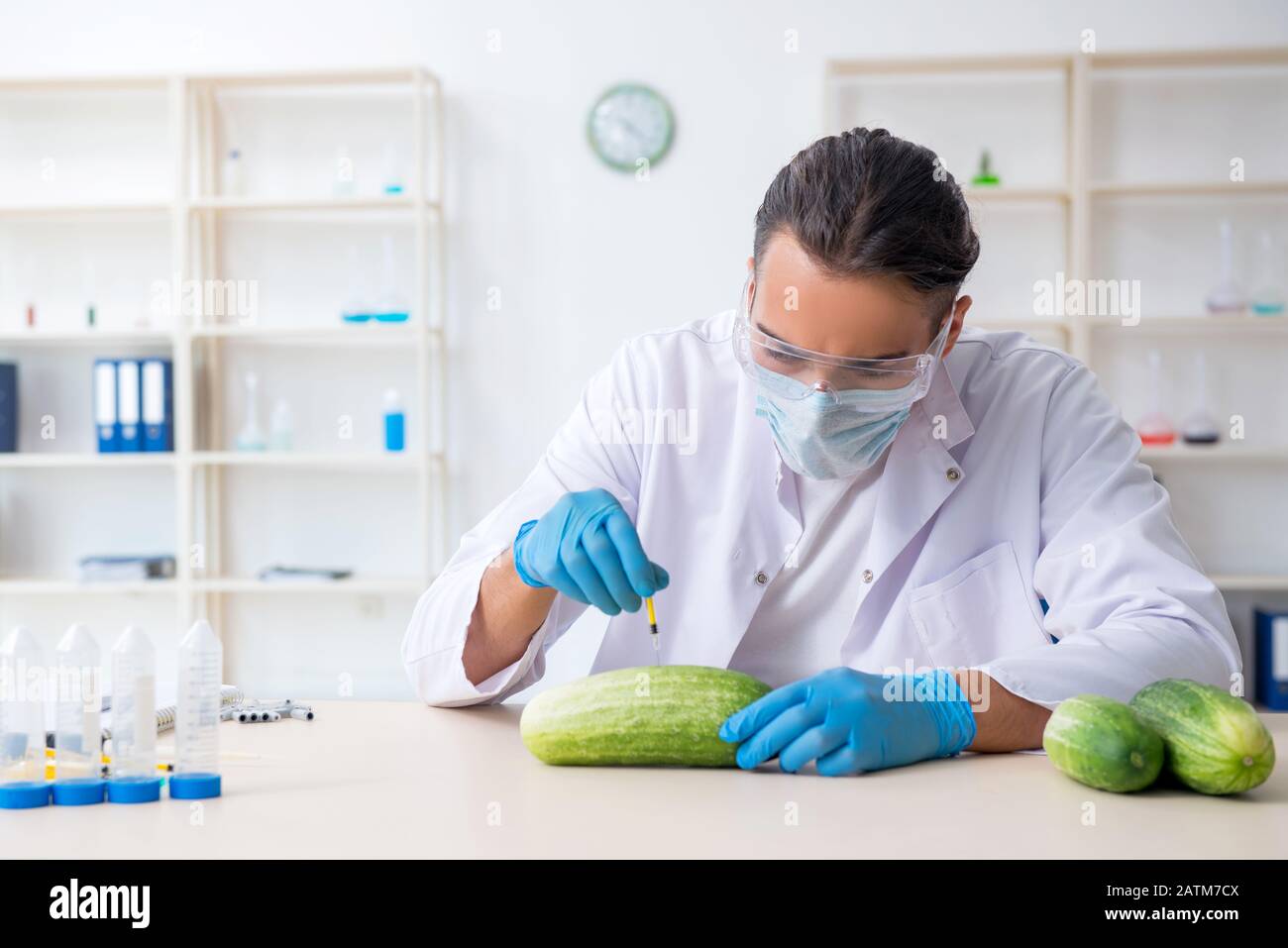 The male nutrition expert testing vegetables in lab Stock Photo - Alamy