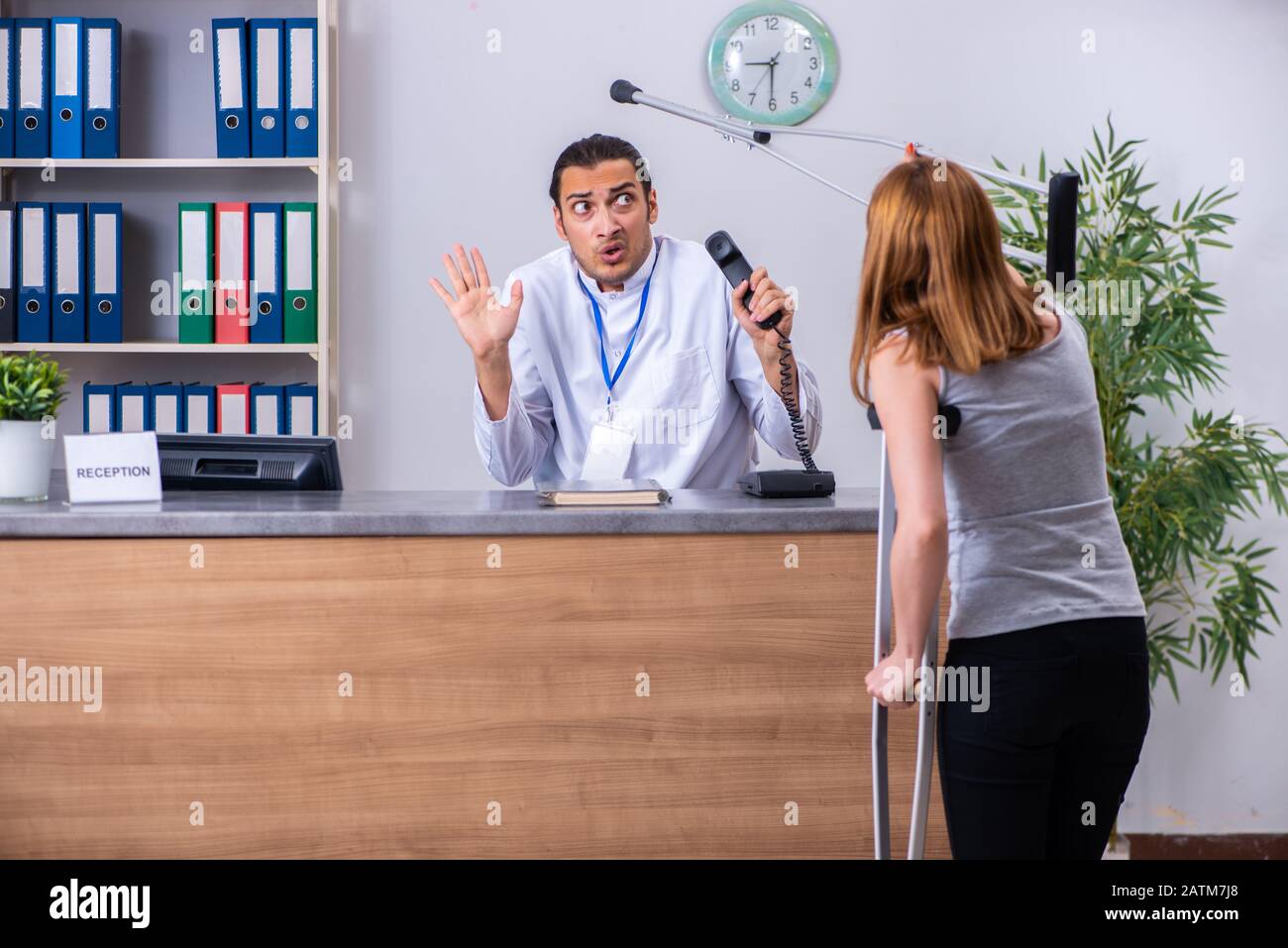 The young patient at the reception in the hospital Stock Photo - Alamy