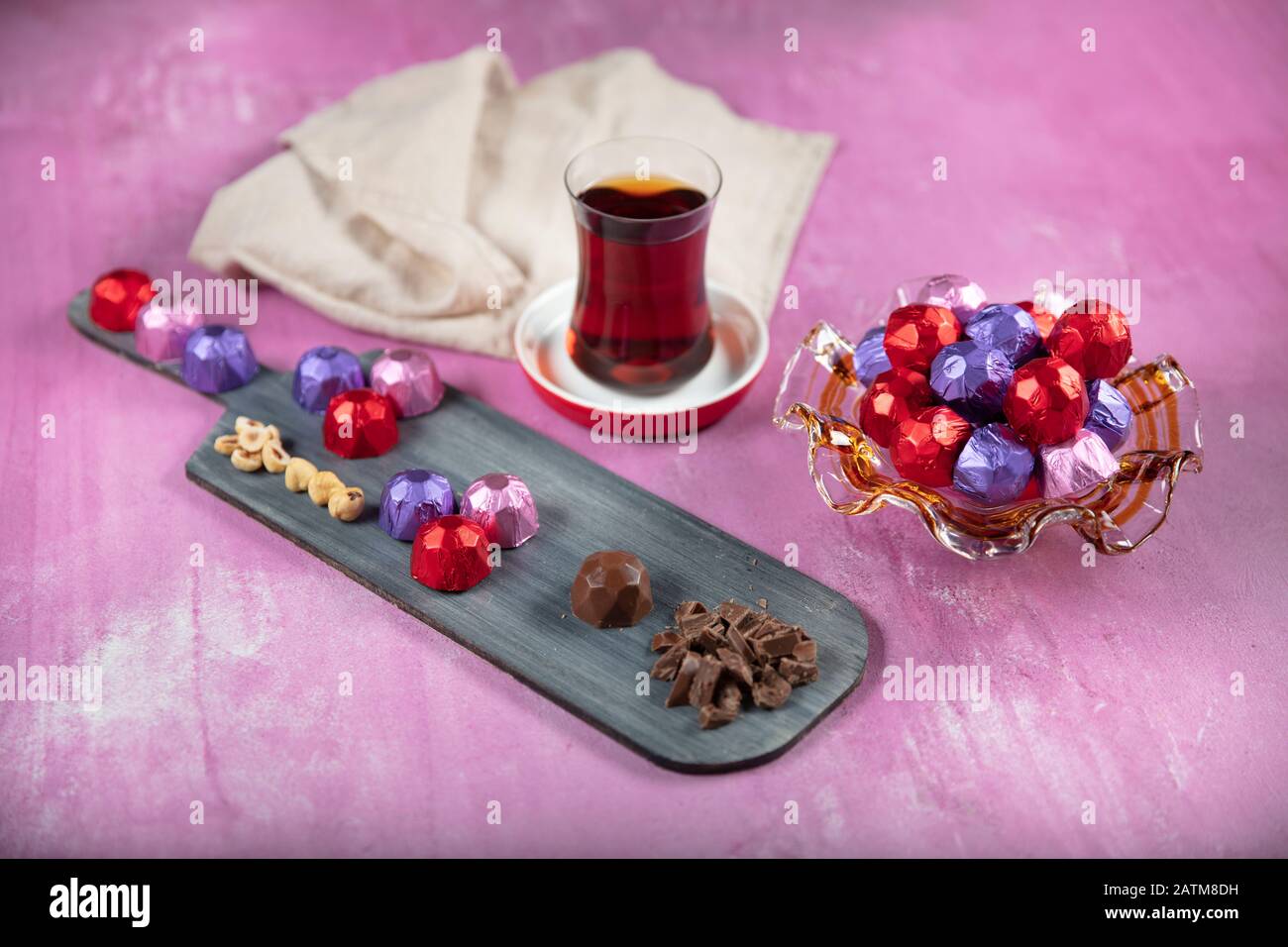 Hazelnut chocolate; hazelnut chocolate covered with red, purple and ...