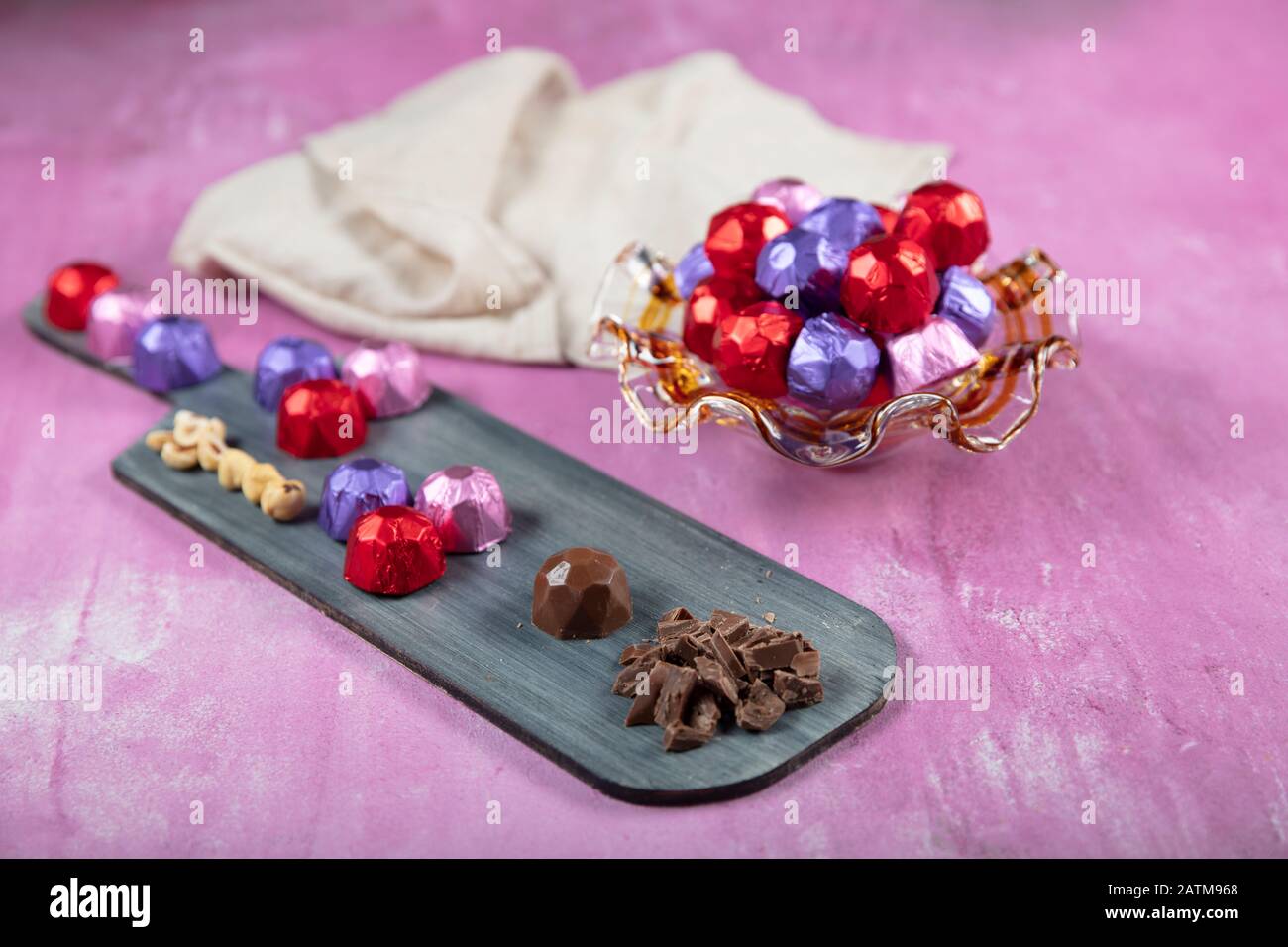 Hazelnut chocolate; hazelnut chocolate covered with red, purple and ...