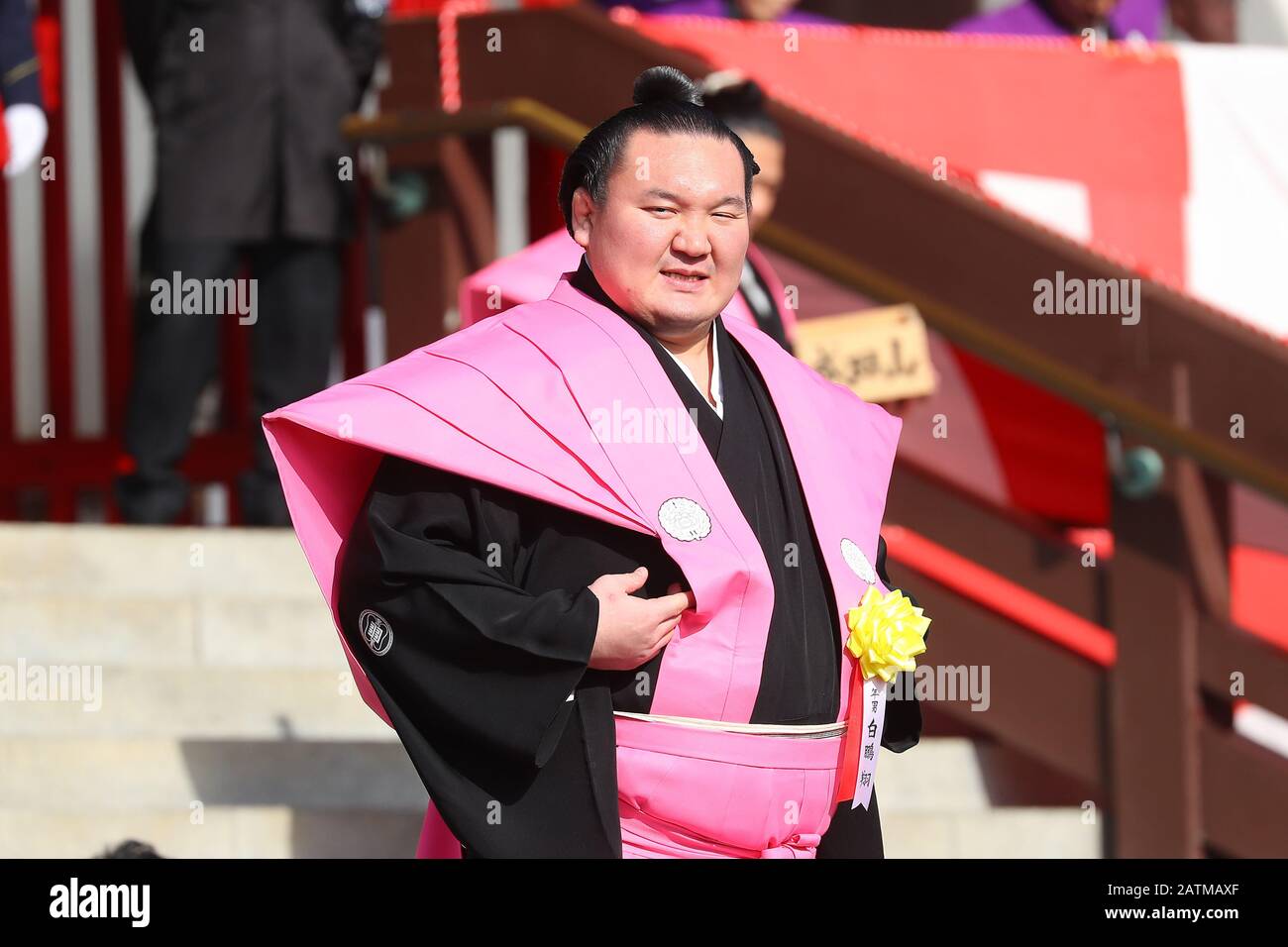 Sumo Yokozuna Hakuho and other invited dignitaries throw bags of beans ...