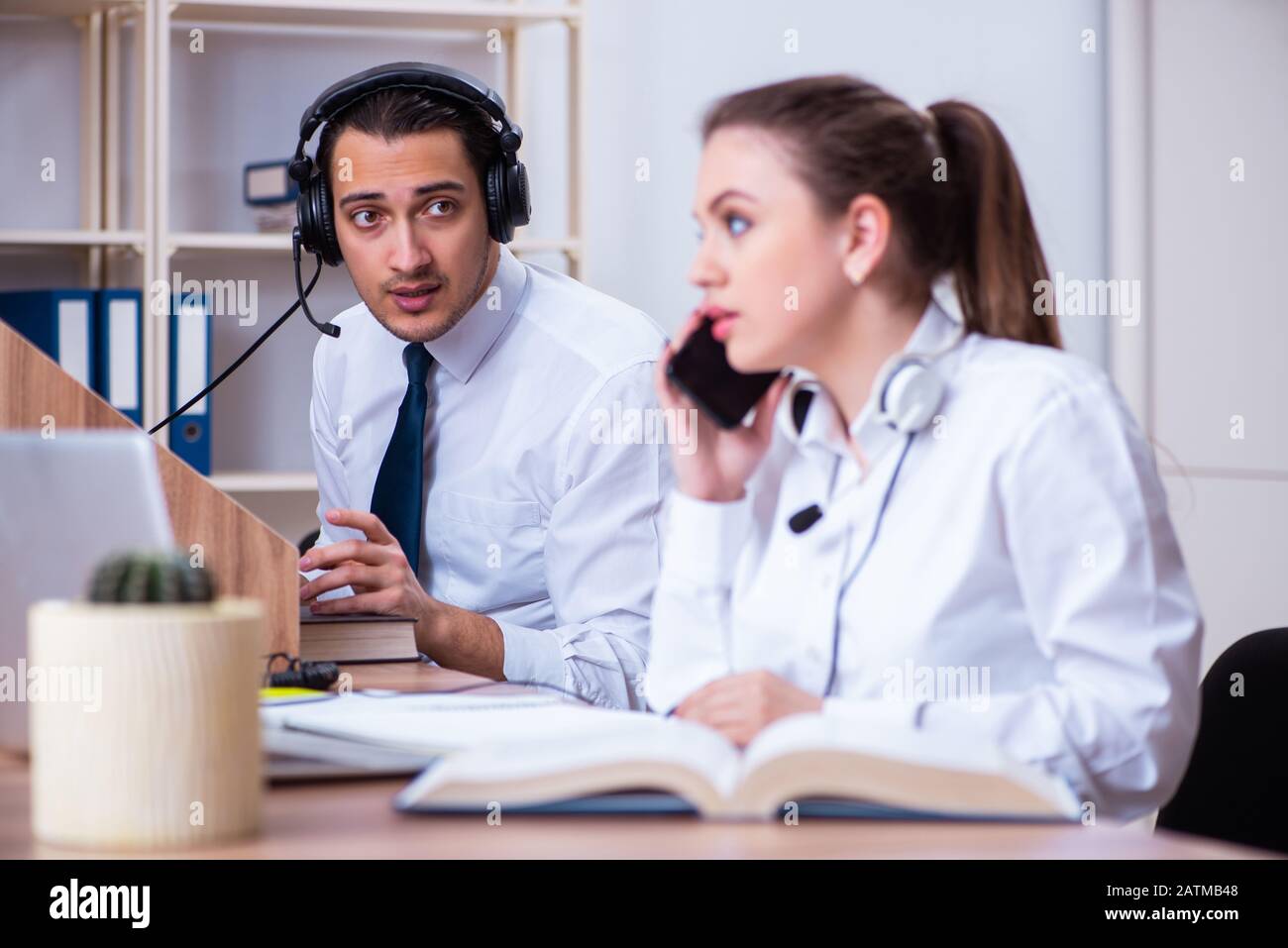 The call center operators working in the office Stock Photo - Alamy