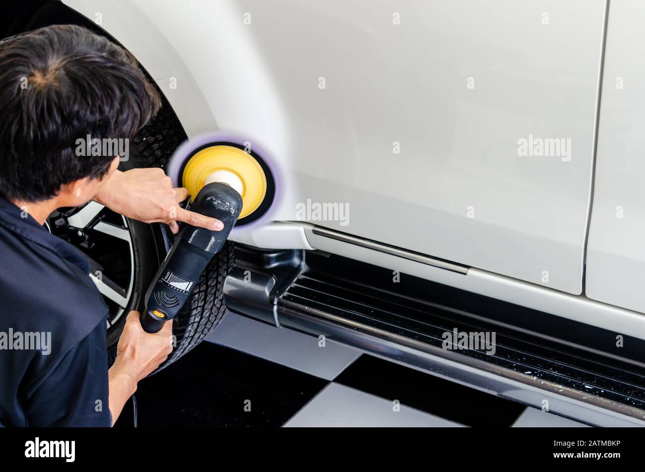 Man hands holding the work tool polish the car.Buffing and polishing ...