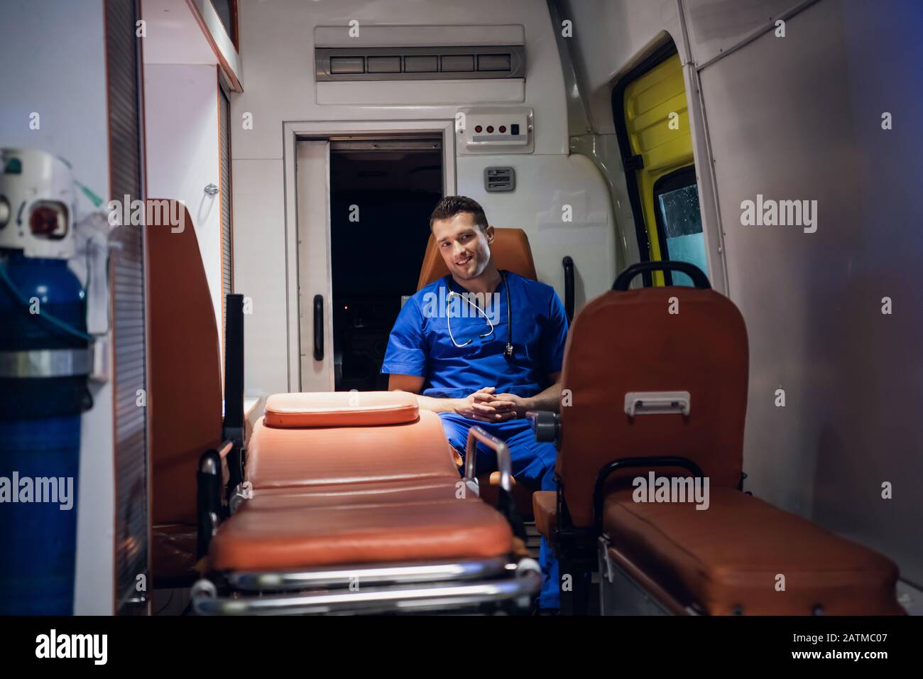 Corpsman in uniform sits and smiles in the ambulance car Stock Photo ...