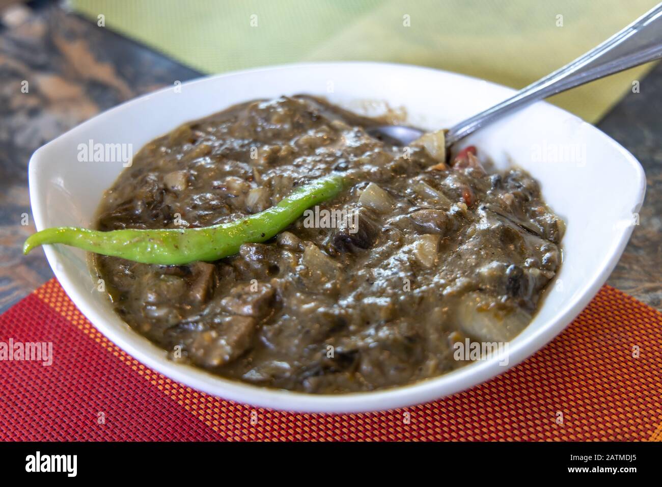 Laing is a Filipino dish composed of dried taro leaves and coconut milk ...