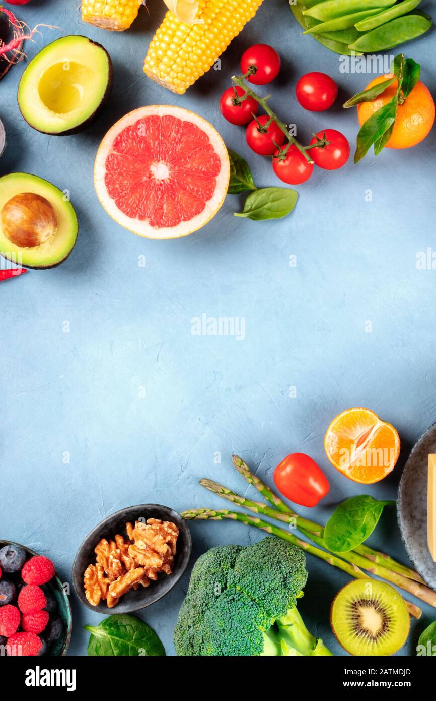 Vegan food background. Vegetables, fruits and nuts, shot from the top ...