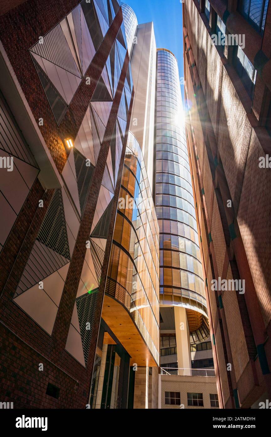 Modern futuristic skyscrapers office building urban background with sun ...