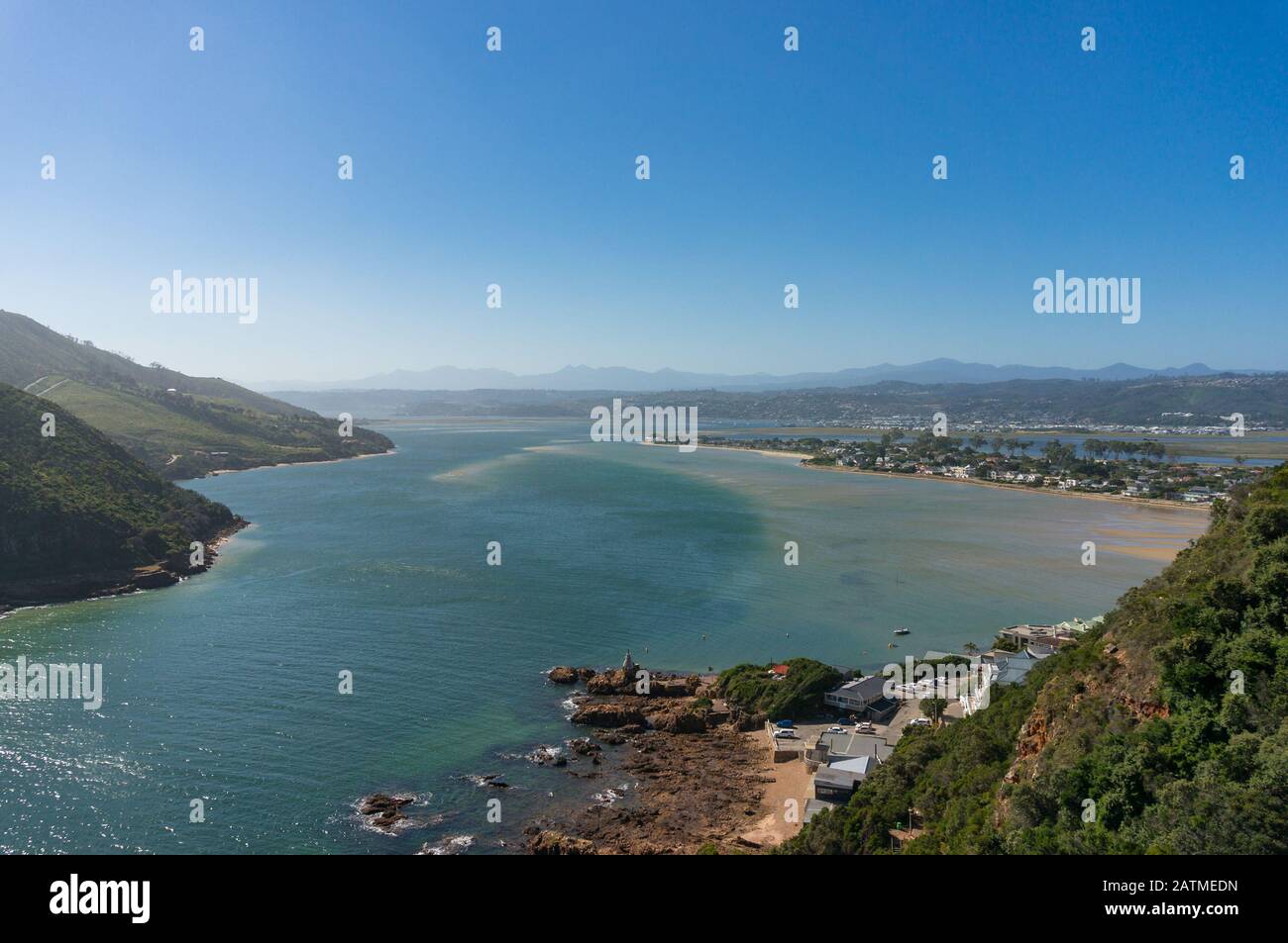 Aerial view of Knysna lagoon with forest covered mountains. Knysna ...