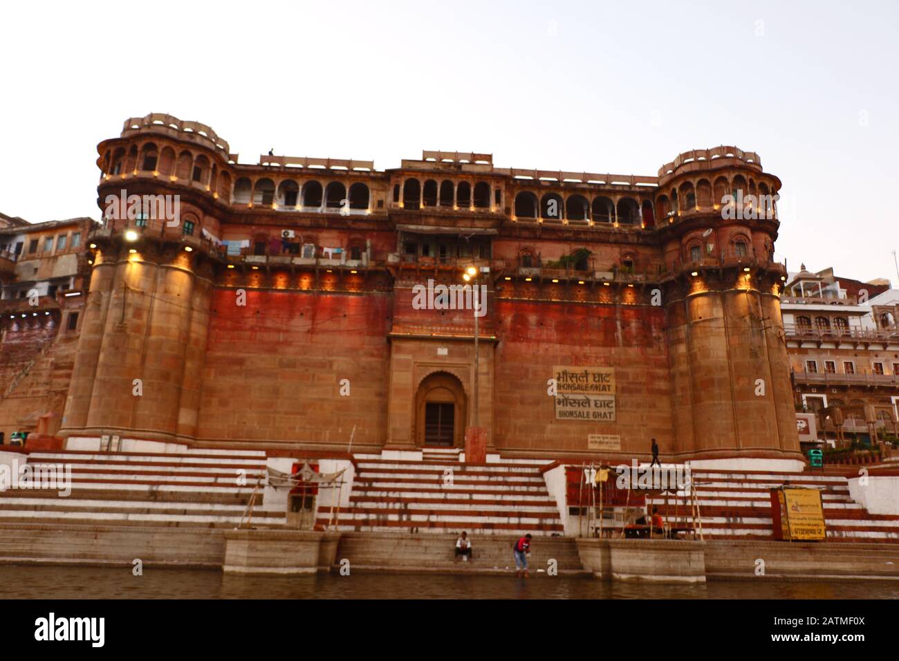 view of popular Assi Ghat with several pilgrims, that stands at the ...