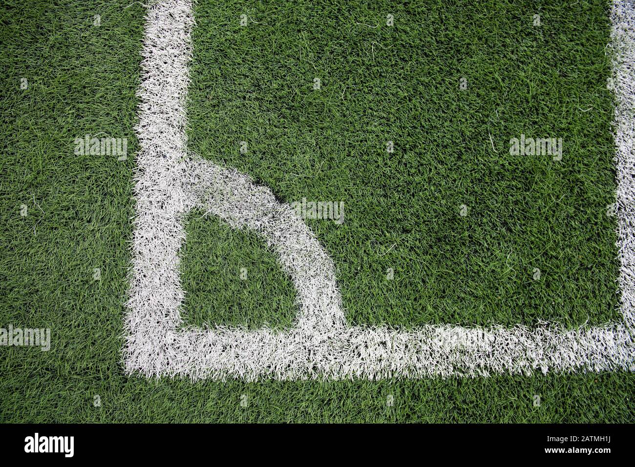 Football field corner with white marks, green artificial grass texture ...