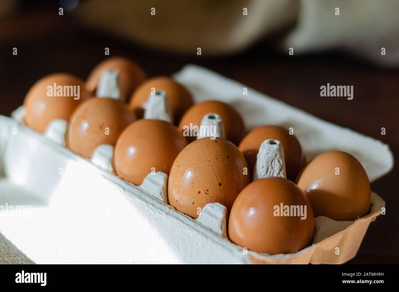 Raw eggs in a cardboard container. Sanitation and hygiene. Close-up ...