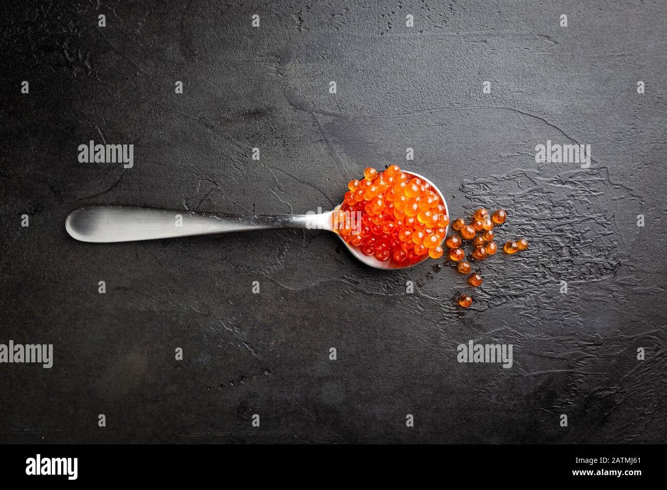 Delicious red caviar on black slate background, top view Stock Photo ...