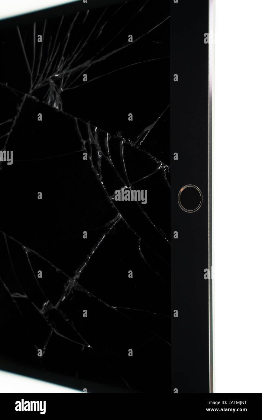 Isolated tablet with broken display, cracked retina screen on white ...