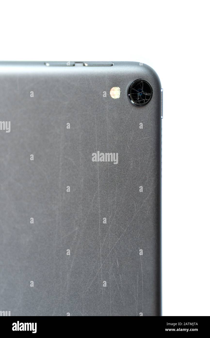 Scratched back side of tablet and broken lens isolated on white ...