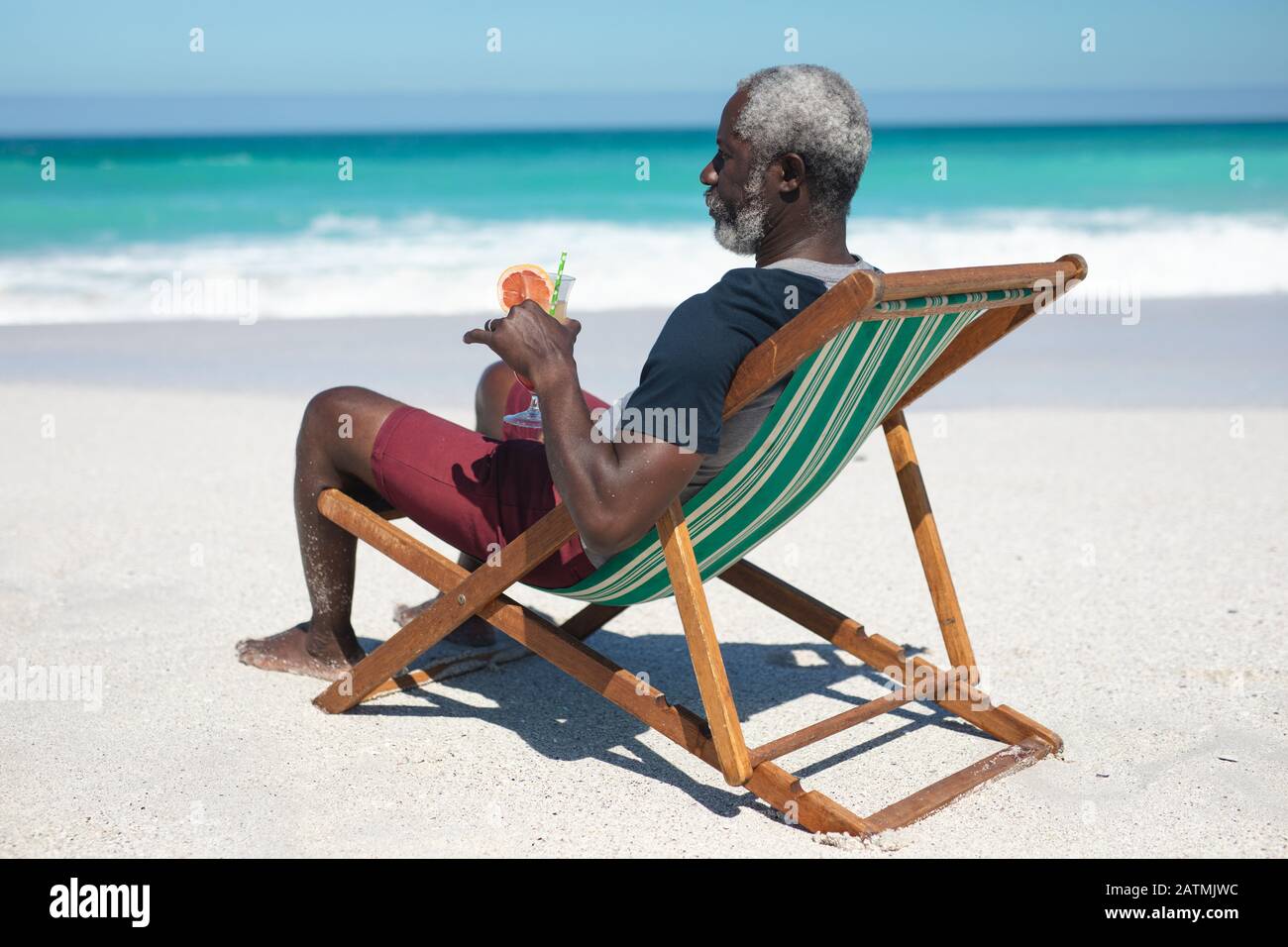 Old man relaxing at the beach Stock Photo - Alamy