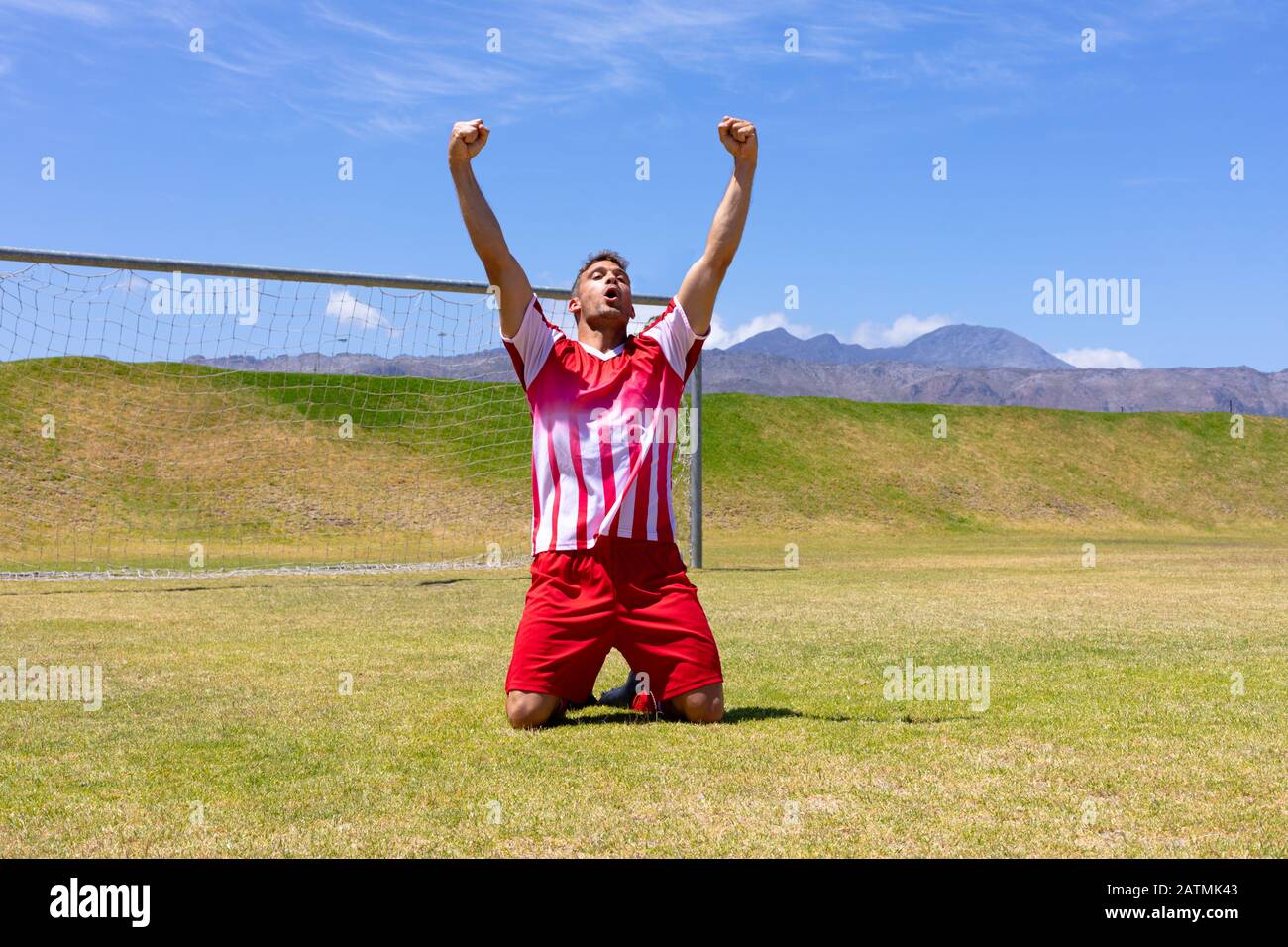 Soccer player happy Stock Photo - Alamy