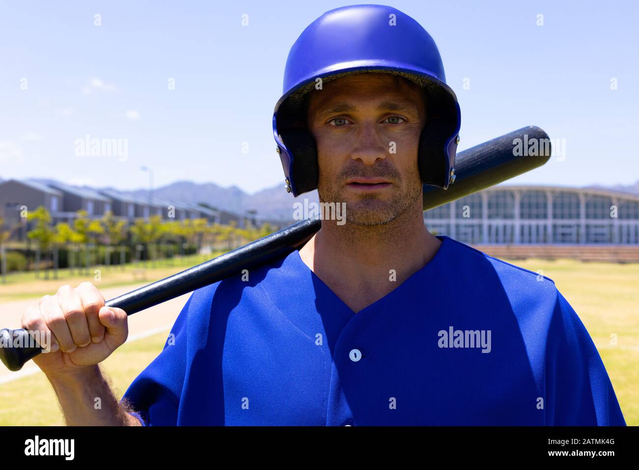 Baseball player looking at camera Stock Photo - Alamy
