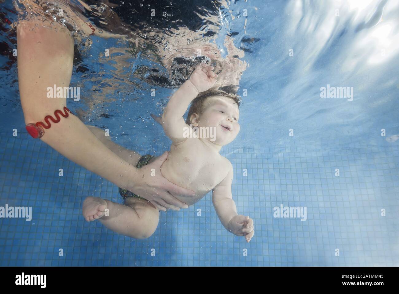 Newborn learning to swim hi-res stock photography and images - Alamy