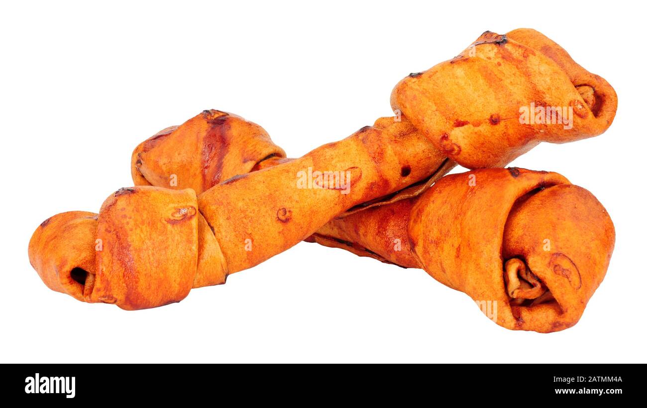 Rawhide knotted bone shape dog chews isolated on a white background ...