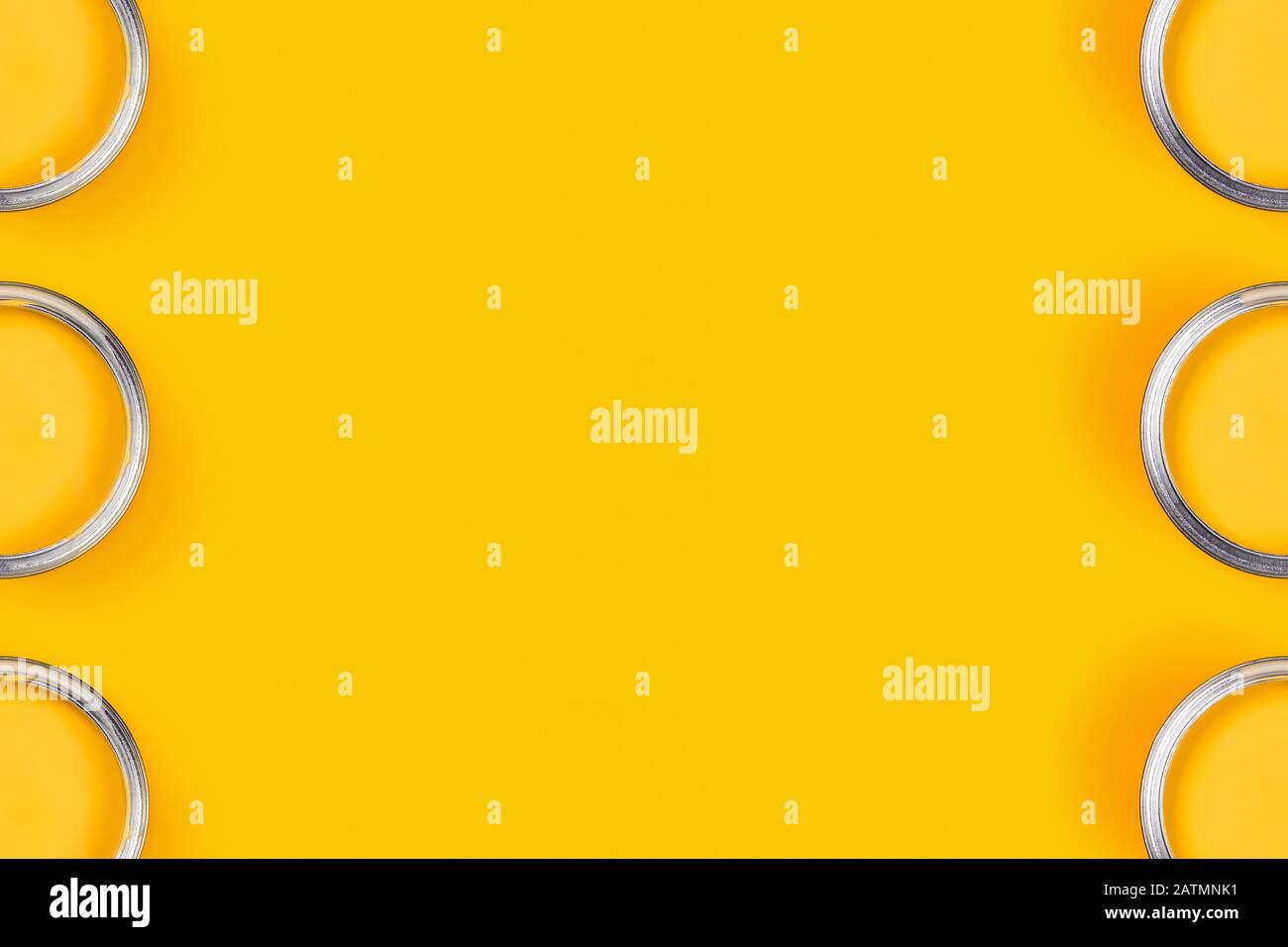 Repair concept. Yellow background with six paint cans. Flat lay, top ...