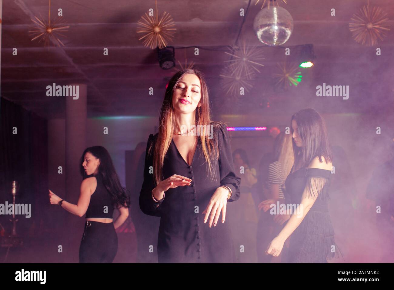 Dancing friends enjoying party in the night club Stock Photo - Alamy