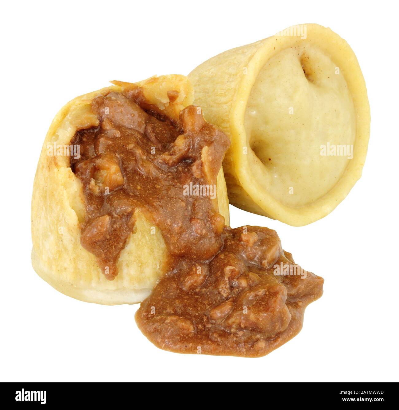Two steamed steak and kidney puddings isolated on a white background ...