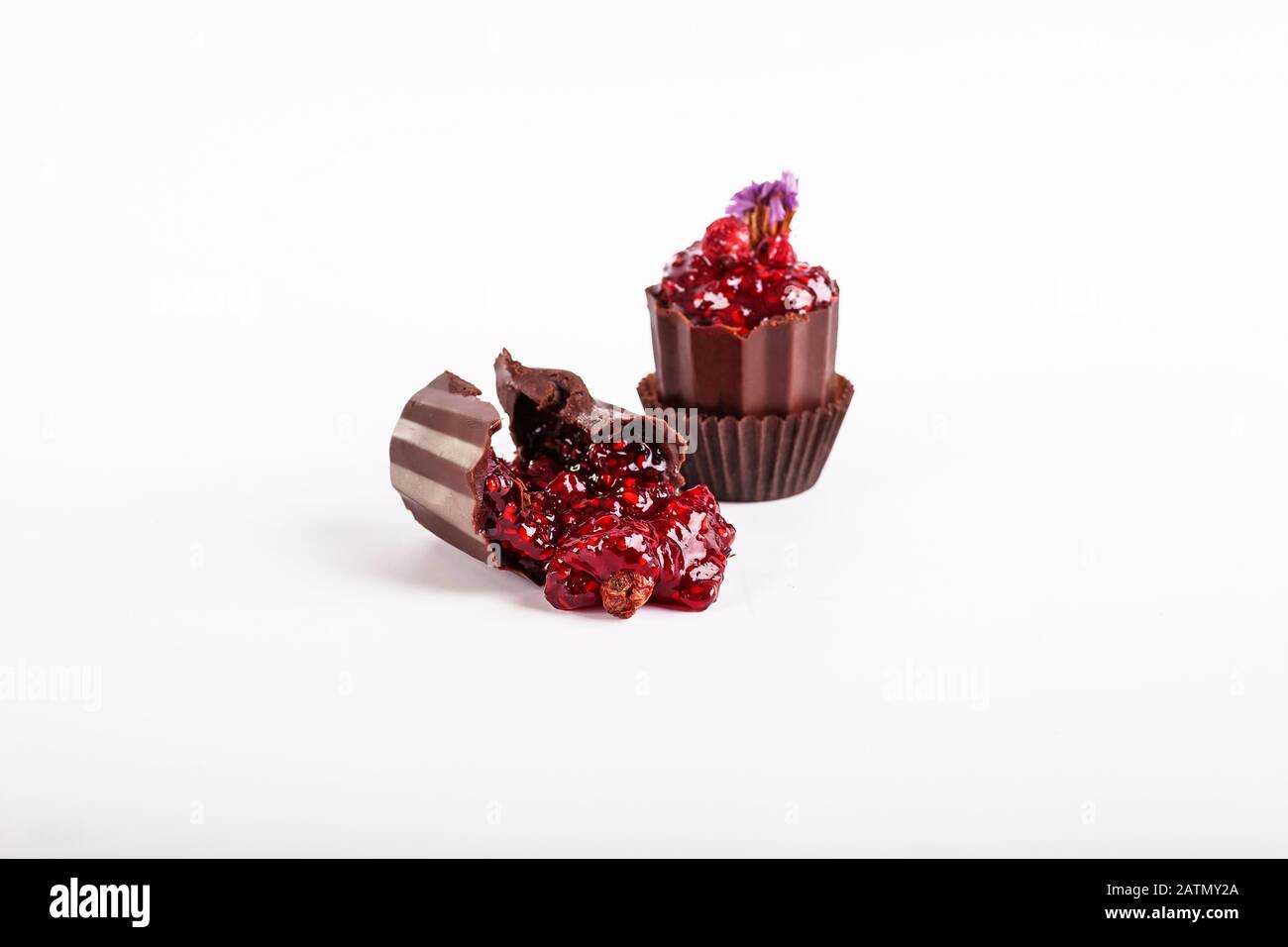 Cut chocolate candy on white background Stock Photo - Alamy