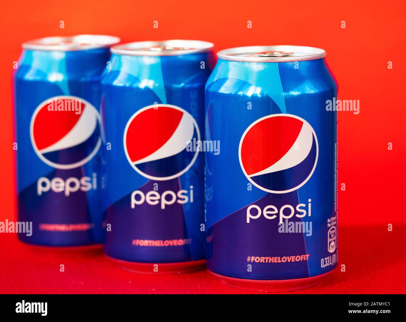 Three aluminum cans of Pepsi on a red background Stock Photo - Alamy