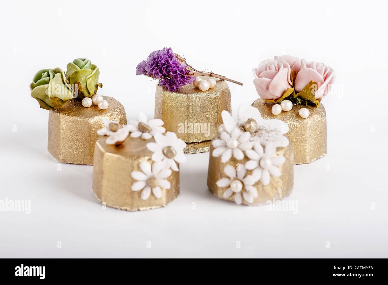 Gold wedding sweets on white background Stock Photo - Alamy